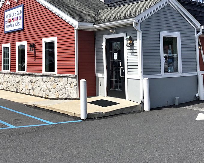 The distinctive red siding and stone foundation of Marblehead Chowder House stands as a New England lighthouse in Pennsylvania's culinary landscape, beckoning seafood lovers home. 