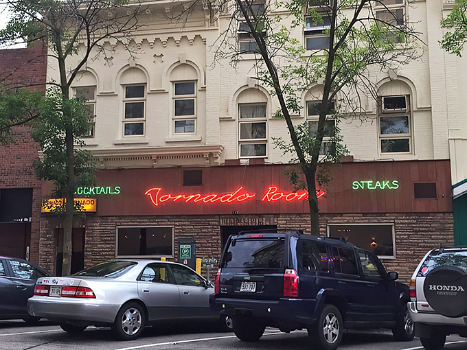 The neon glow of Tornado's sign cuts through Madison's evening air like a beacon for carnivores seeking refuge from ordinary dining experiences.