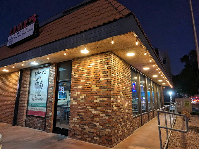 Luke's of Chicago stands like a beacon in the Phoenix night, its warm brick exterior promising Windy City comfort in the desert heat.