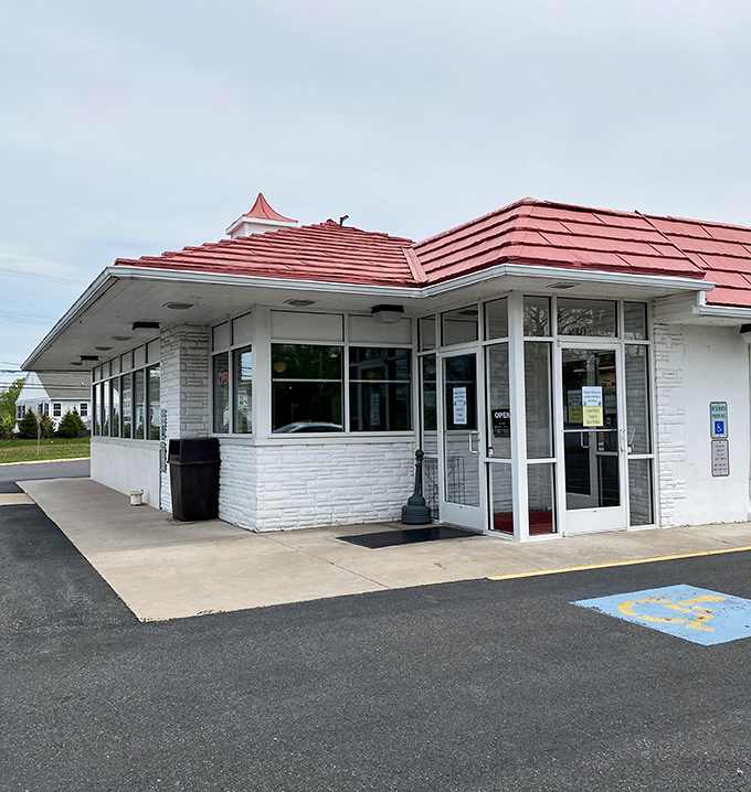 The iconic red roof of Speck's Drive-In stands as a beacon of comfort food promise in Collegeville, like a culinary lighthouse guiding hungry travelers home.
