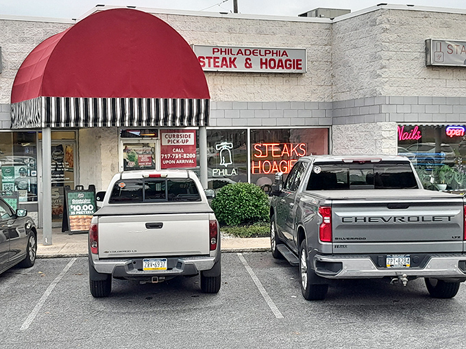 The red awning beckons like a culinary lighthouse on Carlisle Pike, promising authentic Philadelphia flavors without the I-95 traffic headaches.