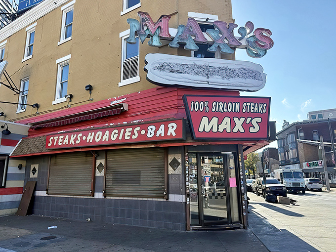 The iconic Max's Steaks sign beckons hungry Philadelphians like a neon North Star. No frills, just the promise of cheesesteak perfection.