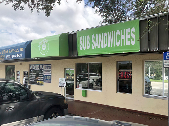 The unassuming green storefront of Mickey's Subs stands as a beacon of sandwich salvation for Tampa locals who know that culinary treasures often hide in plain sight.