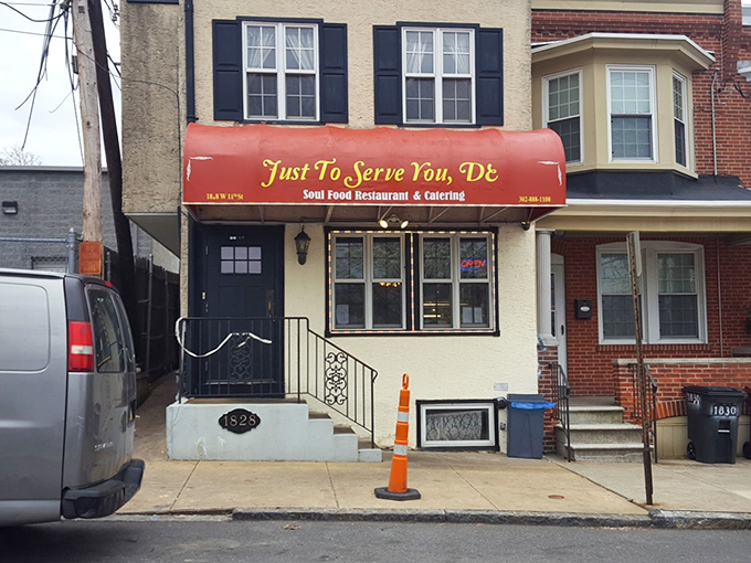 The unassuming red awning of Just To Serve You, DE beckons like a secret handshake among food lovers. Delaware's soul food sanctuary hides in plain sight.
