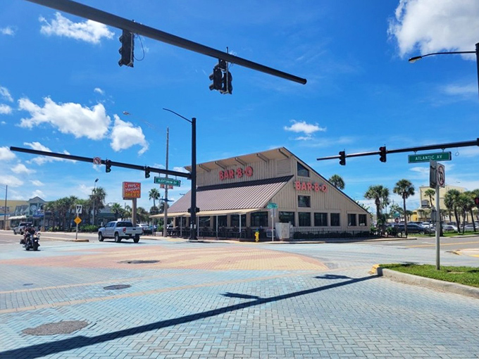 The iconic Hog Heaven sign beckons like a barbecue lighthouse against the Florida sky, promising smoky delights just steps from Daytona's famous beach.