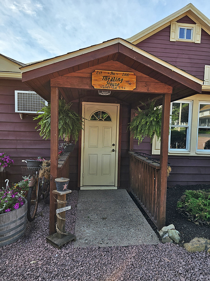 The unassuming burgundy exterior of The Meating House in Drums, PA, where hanging ferns and wooden rocking chairs invite you to "come as you are" for an extraordinary meal.