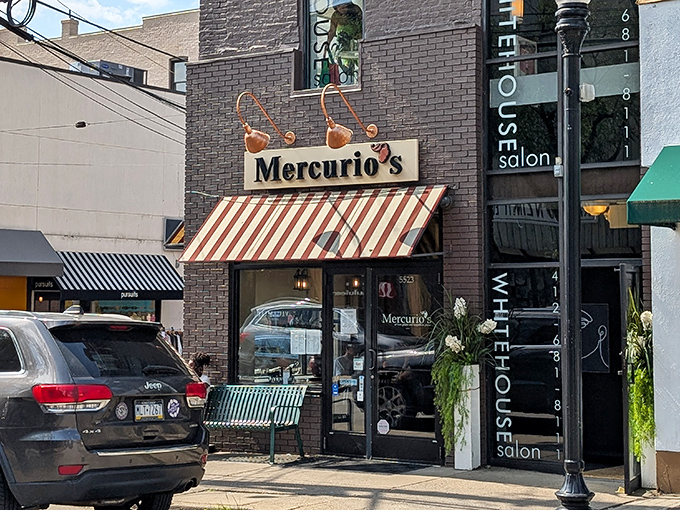 The unassuming storefront with its classic red and white awning hides pizza greatness within. Mercurio's exterior is Pittsburgh's best-kept Italian secret.