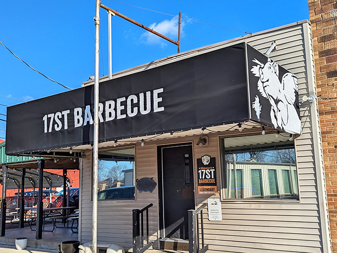The unassuming exterior of 17th Street Barbecue proves once again that the best food often hides behind the simplest facades. That flying pig logo? A promise of smoky delights within.