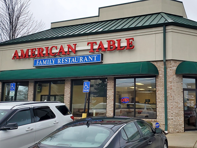 The unassuming exterior of American Table Family Restaurant stands as a beacon of comfort food promise in Oregon, Ohio. Some treasures don't need flashy signs.