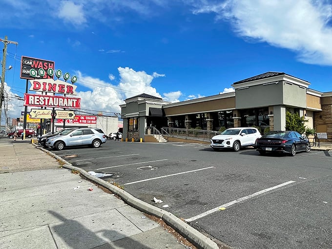 The iconic Oregon Diner sign stands proud against the Philly sky, beckoning hungry travelers with promises of comfort food paradise.