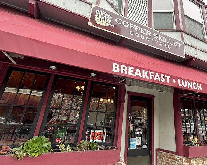 The crimson awning beckons like a breakfast lighthouse in downtown Martinez, promising comfort food salvation for hungry souls wandering Main Street.