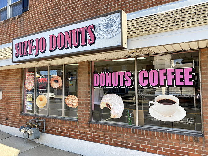 The pink signage of Suzy-Jo Donuts beckons like a sugary lighthouse on Bridgeport's main drag, promising sweet salvation to the donut-deprived.