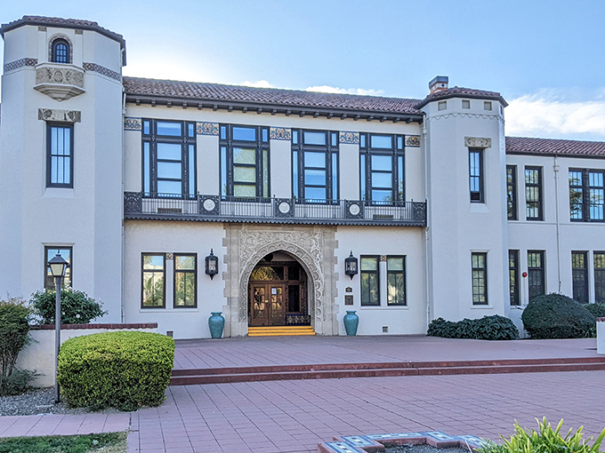 The entrance beckons with ancient Egyptian charm, complete with a seated scribe figure that seems to say, "Come on in, I've been waiting 5,000 years for you!"