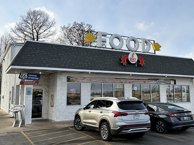 The iconic Cozy Dog Drive In exterior stands proudly along Route 66, its vintage signage beckoning hungry travelers like a deep-fried lighthouse on the prairie.