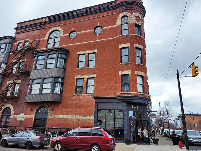 Historic charm meets modern flavor at this corner brick building in downtown Portsmouth. The curved architecture whispers stories of Ohio's past while promising delicious adventures inside.