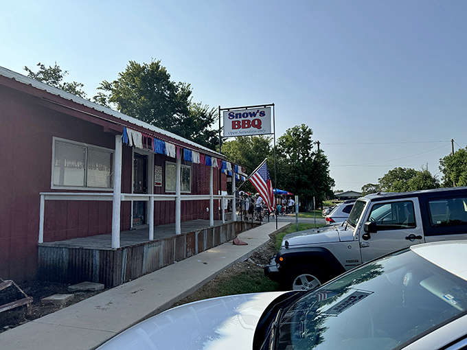 The pilgrimage begins here – colorful streamers flutter above eager barbecue devotees waiting for their moment of Texas meat transcendence.