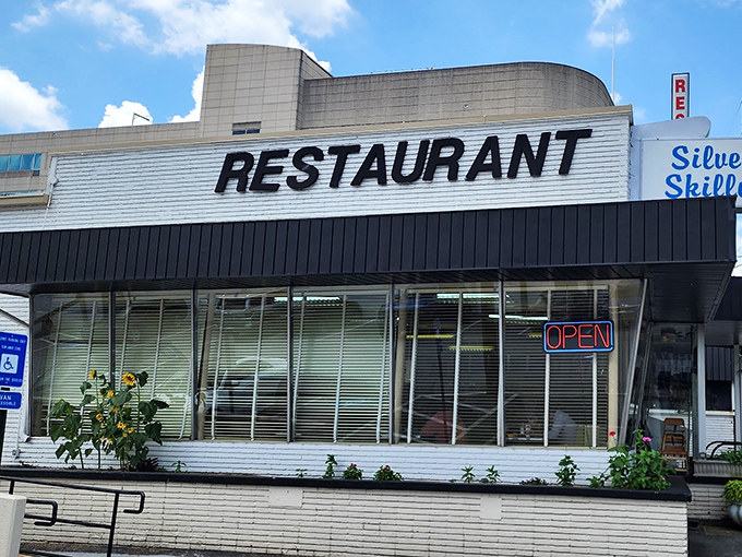 The iconic Silver Skillet facade stands as a time capsule of Americana, promising comfort food treasures within its vintage walls.