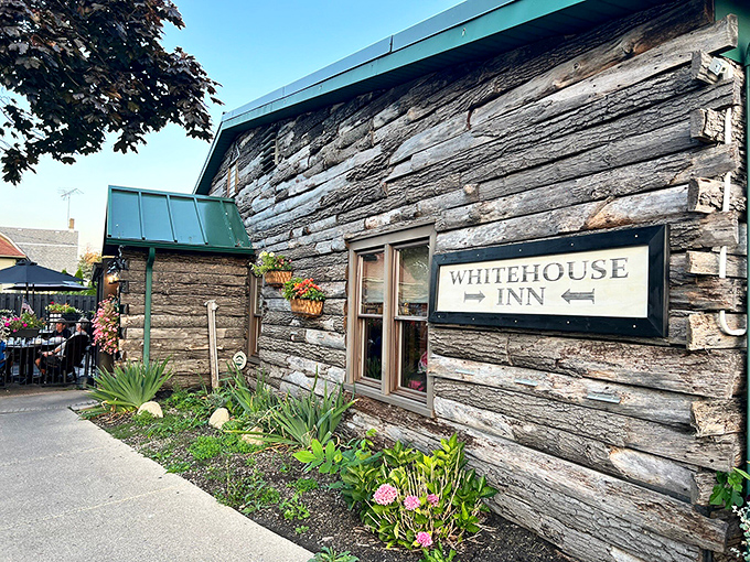 The log cabin exterior of The Whitehouse Inn isn't trying to be rustic chic &ndash; it's the real deal, complete with a patio that beckons you to linger.
