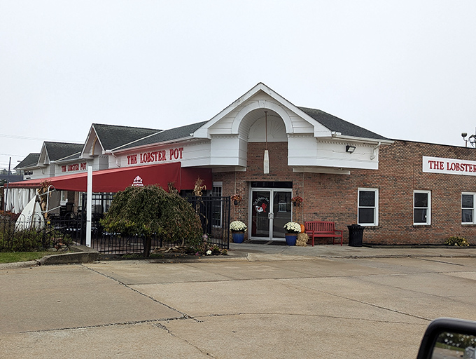 The Lobster Pot's charming exterior combines brick warmth with coastal flair, like New England decided to vacation in Ohio and never left.