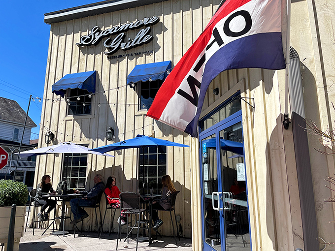 The charming exterior promises culinary adventures ahead, with blue awnings beckoning like a lighthouse for hungry souls.