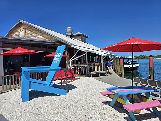 The shark-adorned entrance says it all: this isn't fancy Florida dining, it's the real deal. Those red benches have witnessed countless hungry pilgrims awaiting seafood nirvana.