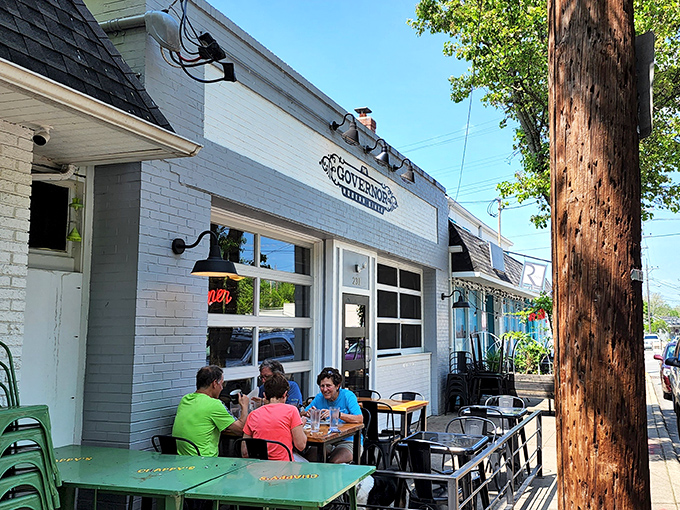 The white-brick fa&ccedil;ade of The Governor welcomes diners with charming outdoor seating. Hanging ferns and street-side tables create the perfect people-watching perch.