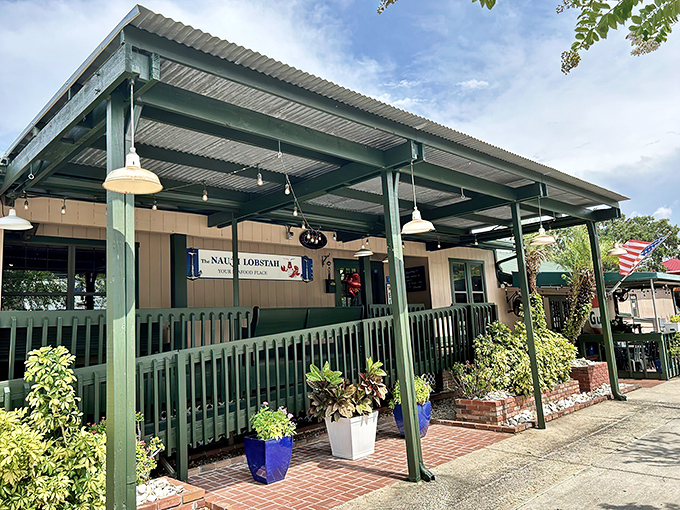 The Nauti Lobstah's seafoam-green exterior beckons like a coastal mirage in landlocked Apopka, complete with a vintage Gulf sign that whispers, "Seafood sanctuary ahead."