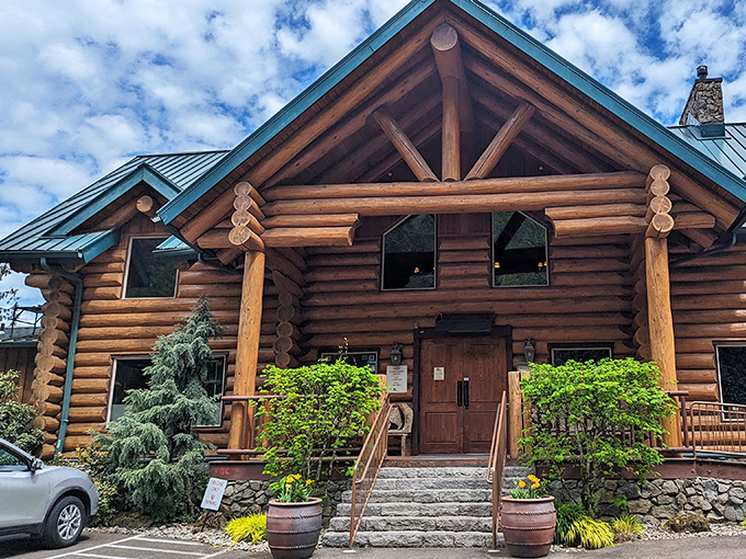 A woodland retreat that doesn't whisper "rustic charm" &ndash; it shouts it with those magnificent logs and that striking teal roof. Pacific Northwest architecture at its finest!