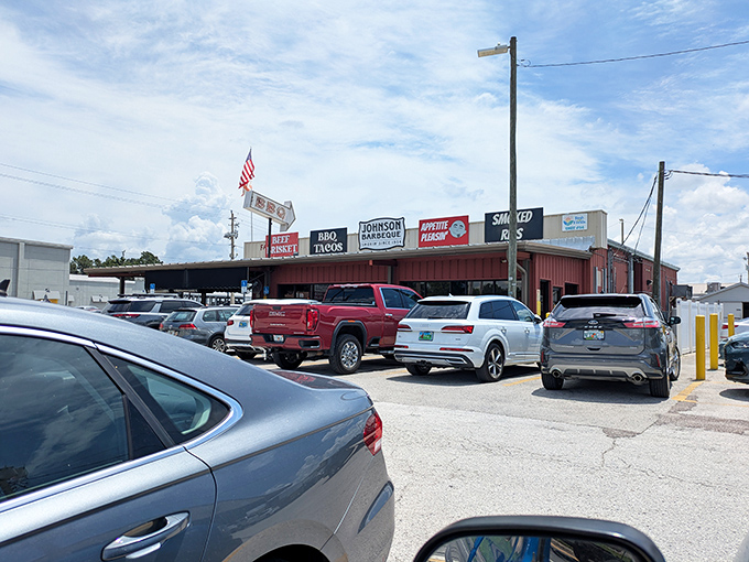 The unassuming exterior of Johnson Barbeque stands proudly under Florida's blue sky, a humble temple of smoke where BBQ dreams come true.