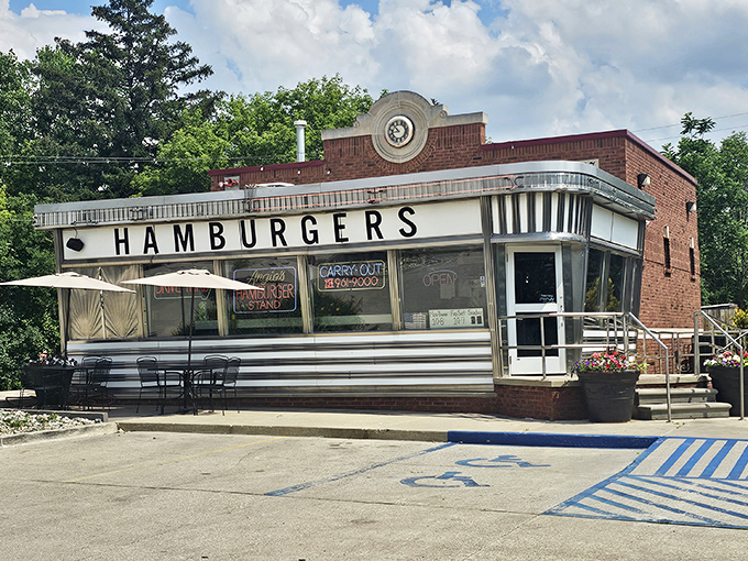 The gleaming silver exterior of Angie's Hamburger Stand stands like a time capsule from the golden age of roadside diners, promising simple pleasures done right.