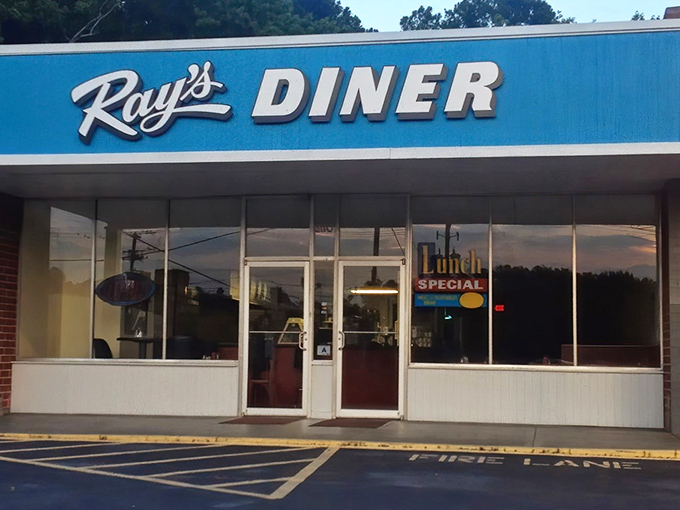 The iconic blue sign of Ray's Diner stands as a beacon of breakfast hope on Two Notch Road, promising comfort food that transcends trendy culinary fads.