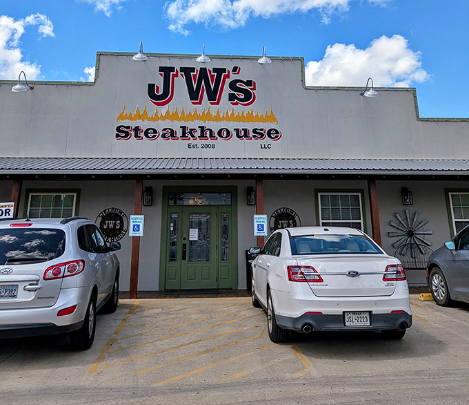 The unassuming exterior of J W's Steakhouse proves once again that in Texas, the most spectacular food often hides behind the most modest facades.