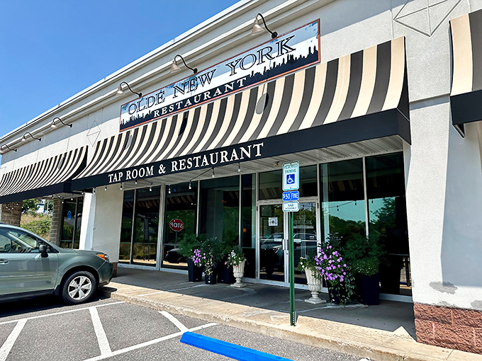 Olde New York's welcoming exterior glows with warm light and promise, like a beacon for hungry travelers in State College.