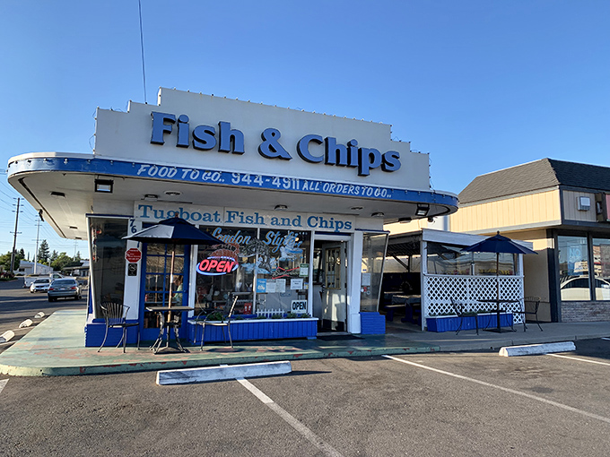 The unassuming storefront of Tugboat Fish & Chips might not stop traffic, but locals know this modest exterior hides seafood gold within.