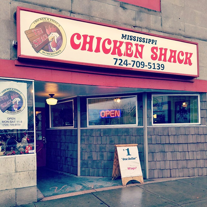 The unassuming storefront of Mississippi Chicken Shack beckons with its bold red sign and humble "$1 Wings!" sidewalk board&mdash;culinary treasures often hide in plain sight.