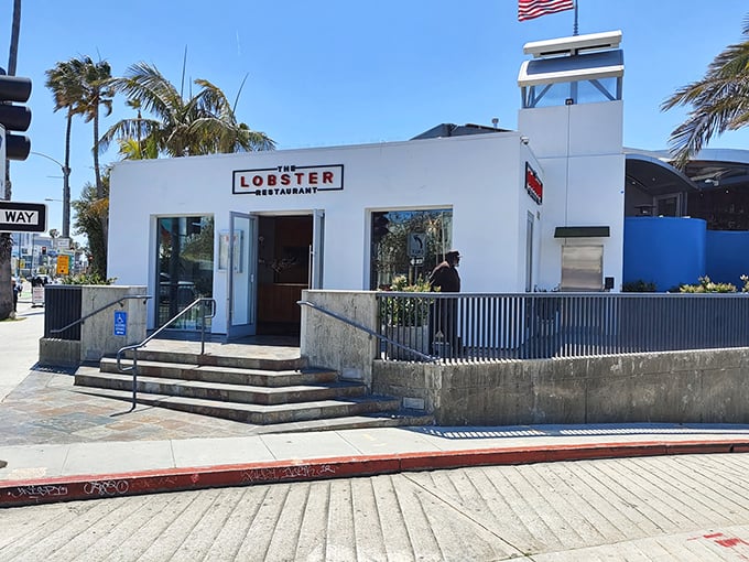 The iconic white exterior of The Lobster stands sentinel at the entrance to Santa Monica Pier, promising seafood treasures with ocean views that'll make your Instagram followers weep.