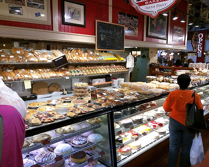 The iconic red walls and gleaming display cases of Beiler's Bakery stand ready for the daily parade of pastry enthusiasts seeking their sugar fix.