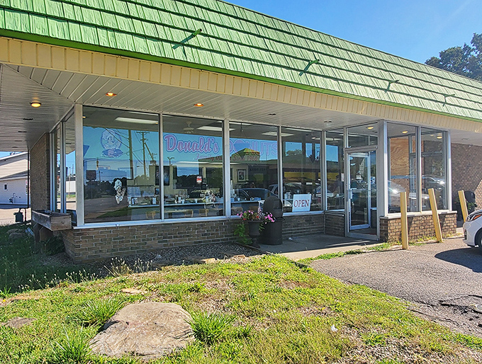 The unmistakable green beacon of breakfast bliss. Donald's distinctive exterior has been calling to donut lovers since 1960, like a sugary lighthouse guiding hungry ships to shore.