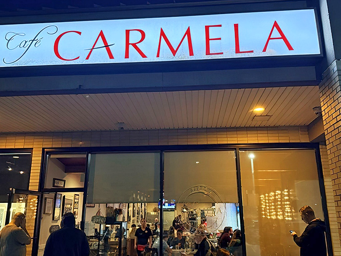 The blue awning and bold red lettering of Café Carmela beckon like an old friend inviting you in for dinner. No neon needed when the food speaks this loudly.