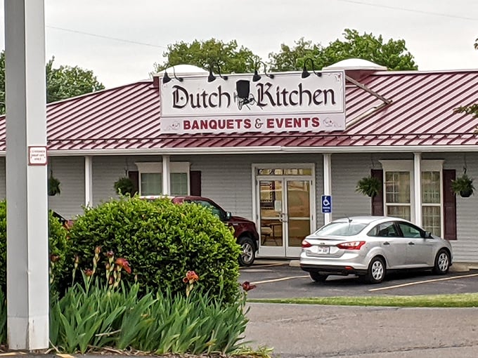 The iconic red-striped roof of Dutch Kitchen welcomes hungry travelers like a beacon of comfort food hope in Amish Country.