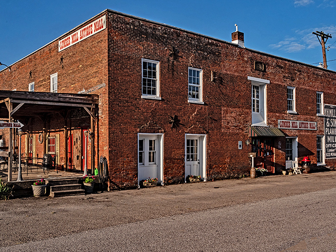 The historic brick facade of Lumber Mill Antique Mall stands proudly in Madison, a time capsule disguised as a building. If walls could talk, these would tell you to come inside and browse awhile.