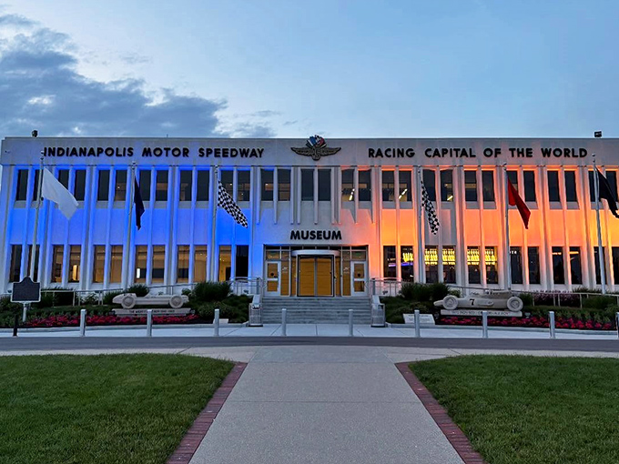 The modernist fa&ccedil;ade of the Indianapolis Motor Speedway Museum stands proudly as the guardian of racing history, with A.J. Foyt's 1970 winner immortalized in concrete out front.