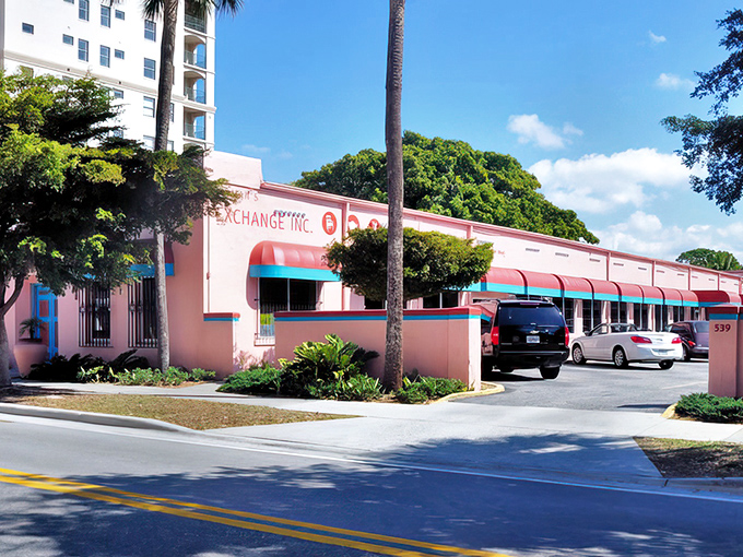 That cheerful coral and turquoise exterior practically shouts "Come discover something amazing inside!"