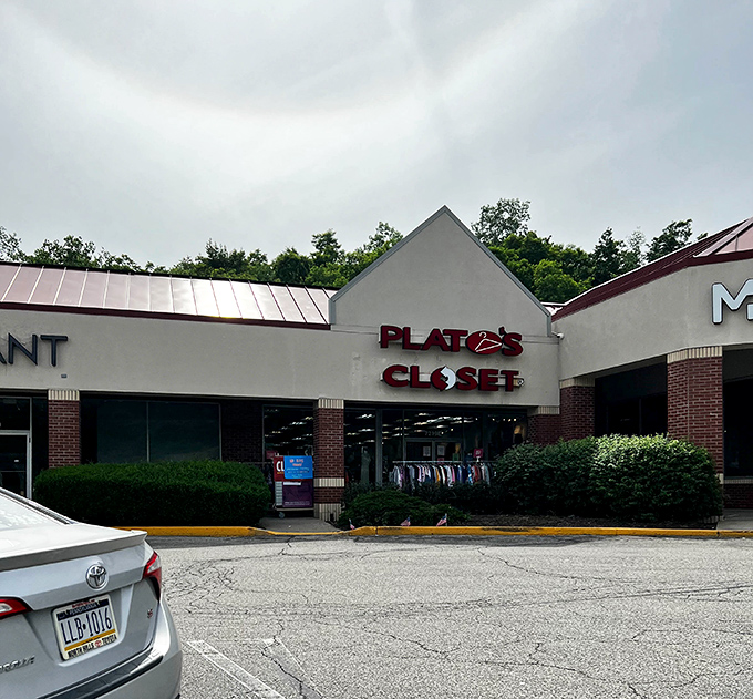 The iconic red Plato's Closet sign beckons like a lighthouse for the fashion-savvy and budget-conscious shopper. Treasure awaits inside!