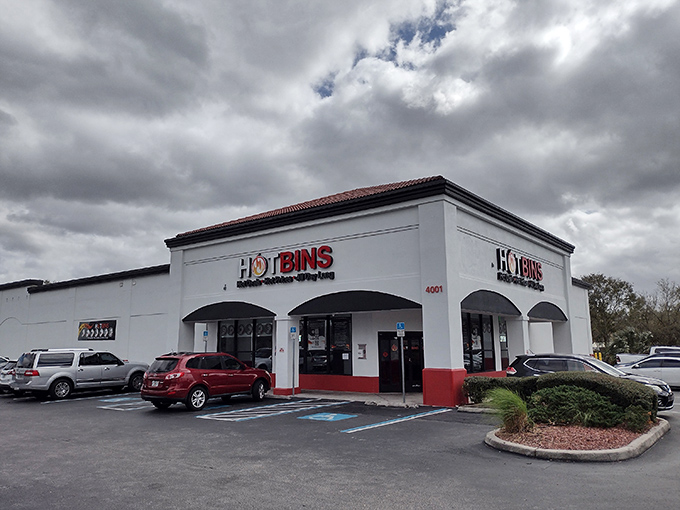 The white stucco facade of Hotbins gleams under Florida sunshine like a retail oasis. Behind those arched windows lies a bargain hunter's paradise that would make Marie Kondo hyperventilate.