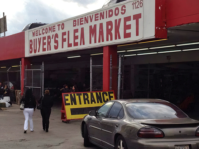The iconic red exterior of Buyer's Flea Market stands like a retail fortress, its packed parking lot a testament to treasure hunters' dedication.