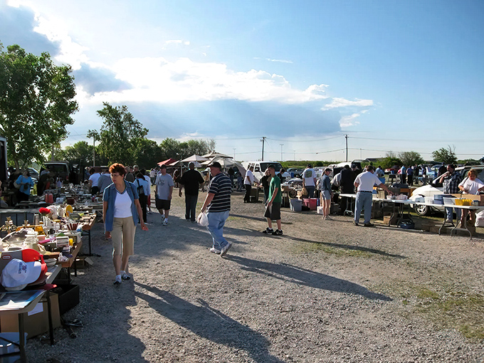 Sunset shopping at its finest &ndash; vendors set up their treasures against a cotton candy sky as early birds hunt for tomorrow's heirlooms.