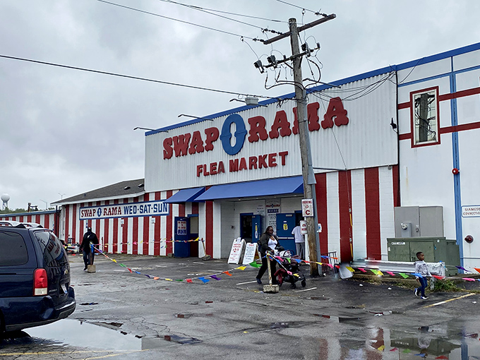 The red, white, and blue facade of Swap-O-Rama stands like a patriotic monument to American bargain hunting&mdash;where treasures await behind those striped walls.