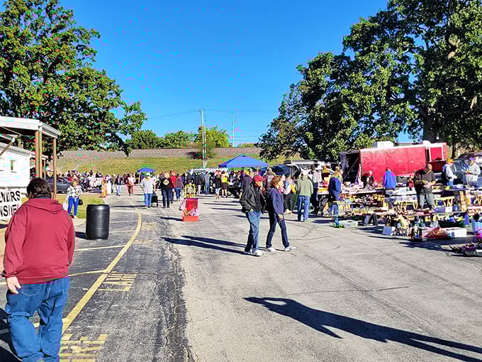Treasure hunting paradise under blue Missouri skies. Colorful canopies shelter vintage finds while shoppers navigate tables laden with yesterday's treasures and tomorrow's conversation pieces.