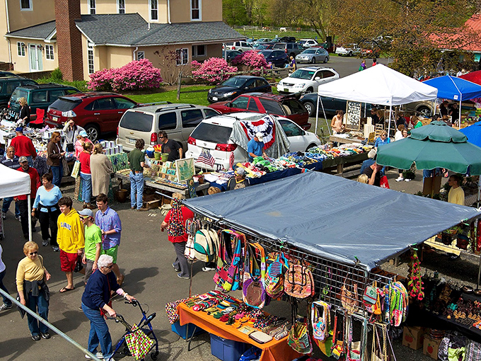 The treasure hunter's paradise unfolds at Rice's Market, where one person's castoffs become another's prized possessions under colorful canopies and spring blossoms.